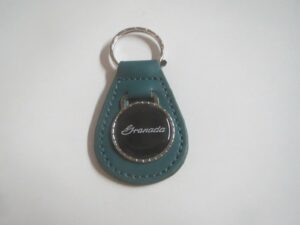 1975 1976 1977 1978 1979 1980 1981 1982 granada script logo leather keychain - teal