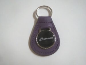 1975 1976 1977 1978 1979 1980 1981 1982 granada script logo leather keychain - purple