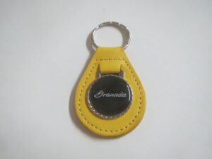 1975 1976 1977 1978 1979 1980 1981 1982 granada script logo leather keychain - yellow