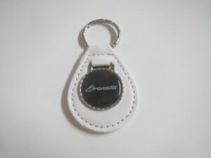 1975 1976 1977 1978 1979 1980 1981 1982 granada script logo leather keychain - white