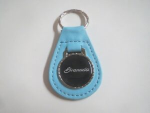 1975 1976 1977 1978 1979 1980 1981 1982 granada script logo leather keychain - light blue