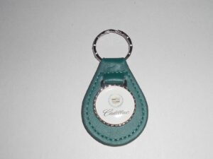 eldorado seville deville fleetwood calais allante logo leather keychain - teal