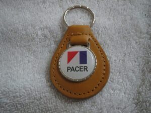 1975 1976 1977 1978 1979 amc pacer logo emblem leather keychain - orange