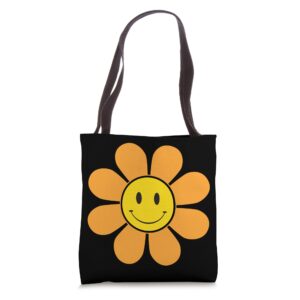 orange 70s retro flower with a yellow smiling face summer tote bag