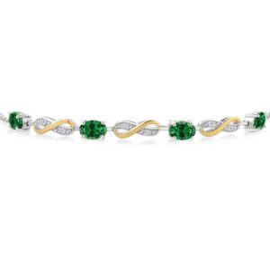 Gem Stone King 925 Sterling Silver and 10K Yellow Gold Green Created Emerald and White Lab Grown Diamond Tennis Bracelet For Women (1.45 Cttw, Oval 6X4MM, Fully Adjustable Up to 7.5 Inch)