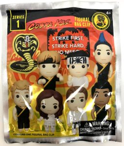 cobra kai series 1 - 3d figural foam bag clip in blind bag - strike first, strike hard, no mercy multicolored