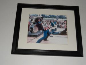 framed wayne kramer from the mc5 on stage with flag guitar 1968 14" by 17"