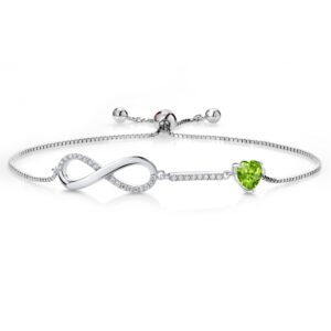 gem stone king 925 sterling silver heart shape 6mm gemstone birthstone and white moissanite infinity tennis bracelet for women fully adjustable up to 9 inch