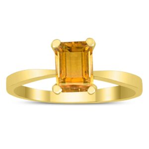 emerald shaped 7x5mm citrine solitaire ring in 10k yellow gold