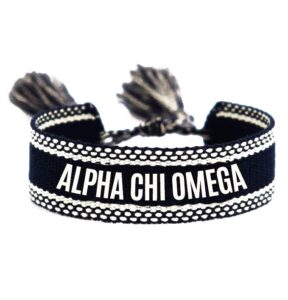 sorority shop alpha chi omega bracelet — woven bracelet, black and white design with aco sorority name and tassels, greek sorority jewelry and big little sorority gifts