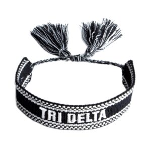 sorority shop delta delta delta bracelet — woven bracelet, black and white design with tri delta sorority name and tassels, greek sorority jewelry and big little sorority gifts