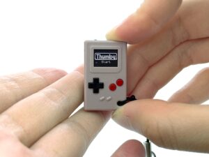 tinycircuits thumby (gray), tiny game console, playable programmable keychain: electronic miniature, stem learning tool