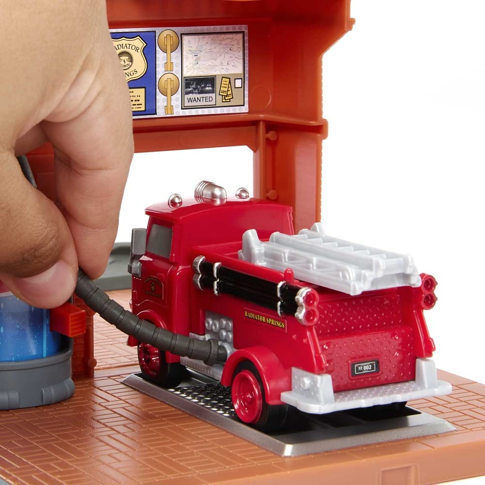 Mattel Disney and Pixar Cars On The Road Toys, Red’s Fire Station Playset with Die-cast Fire Truck & Kid-Activated Action