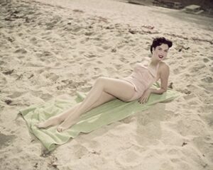 ann miller light pink swimsuit on sand sunbathing 24x36 inch poster