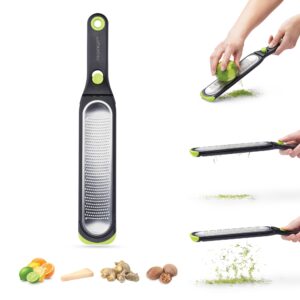 dreamfarm ozest self-cleaning pop-button zester for fine, fluffy citrus zest, cheese, nut, & spices with non-slip silicone foot - 1mm zester, black/green