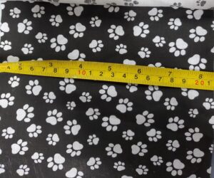 ad fabric, dog paws, print poly cotton fabric by the yard, 60” wide (black)