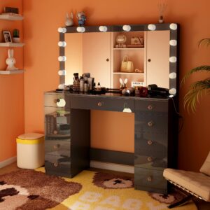 vanity desk with power outlet, makeup vanity with mirror and 14 led lights, 3 lighting mode,11 drawers vanity table with 2 sliding jewelry storage, glass top, specular surface (black)