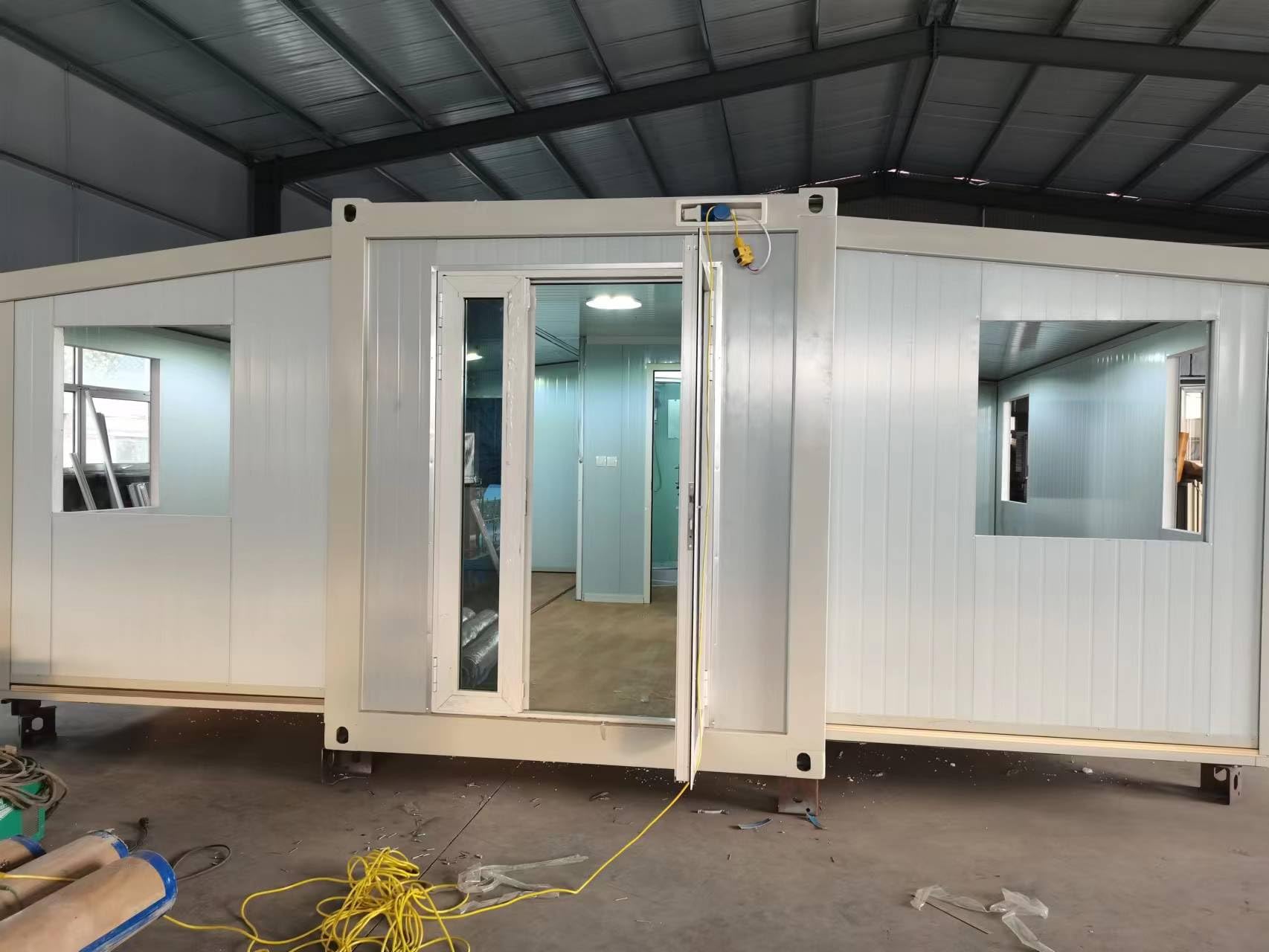 Prefabricated Modular Home with 2 Bedrooms, 1 Kitchen with Well furnished, 1 Bathroom with Exhaust Fan, 1 Living Room with Windows and Glass Doors, Sections