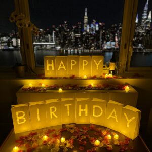 wymm “happy birthday” light up letters with led lights and rose petals included | luminary paper bags to be used as happy birthday decorations for your loved one