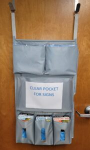 it's sew ez ppe isolation door caddy - 8 pockets - nfpa-701 fire resistant nylon oxford with two stainless steel hooks included (silver)