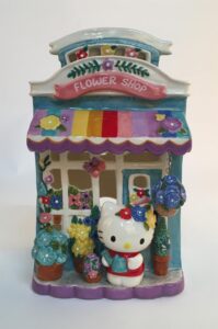 blue sky clayworks hello kitty floral garden flower shop candle house, 7.75-inch height, holiday decoration, red, 23279