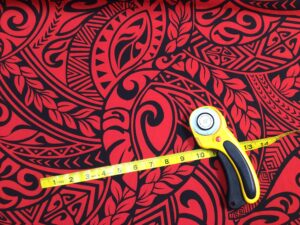 red/black tribal hawaiian print poly/cotton blend fabric sold by the yard