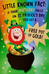 greeting card happy birthday and happy st. patrick's day pot of gold at the end of the rainbow with leprechaun