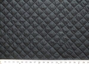 double-faced reversible pre-quilted black polycotton fabric by the yard