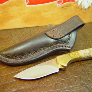 Custom Leather Vertical Knife Sheath. The Sheath Is Made Out of 10 Ounce Water Buffalo Hide Leather with a Border Tooling Dyed Dark Brown. The Sheath Is Made Out of Water Buffalo Leather the Water Buffalo Leather Is Very Soft Pliable and Durable. The Shea