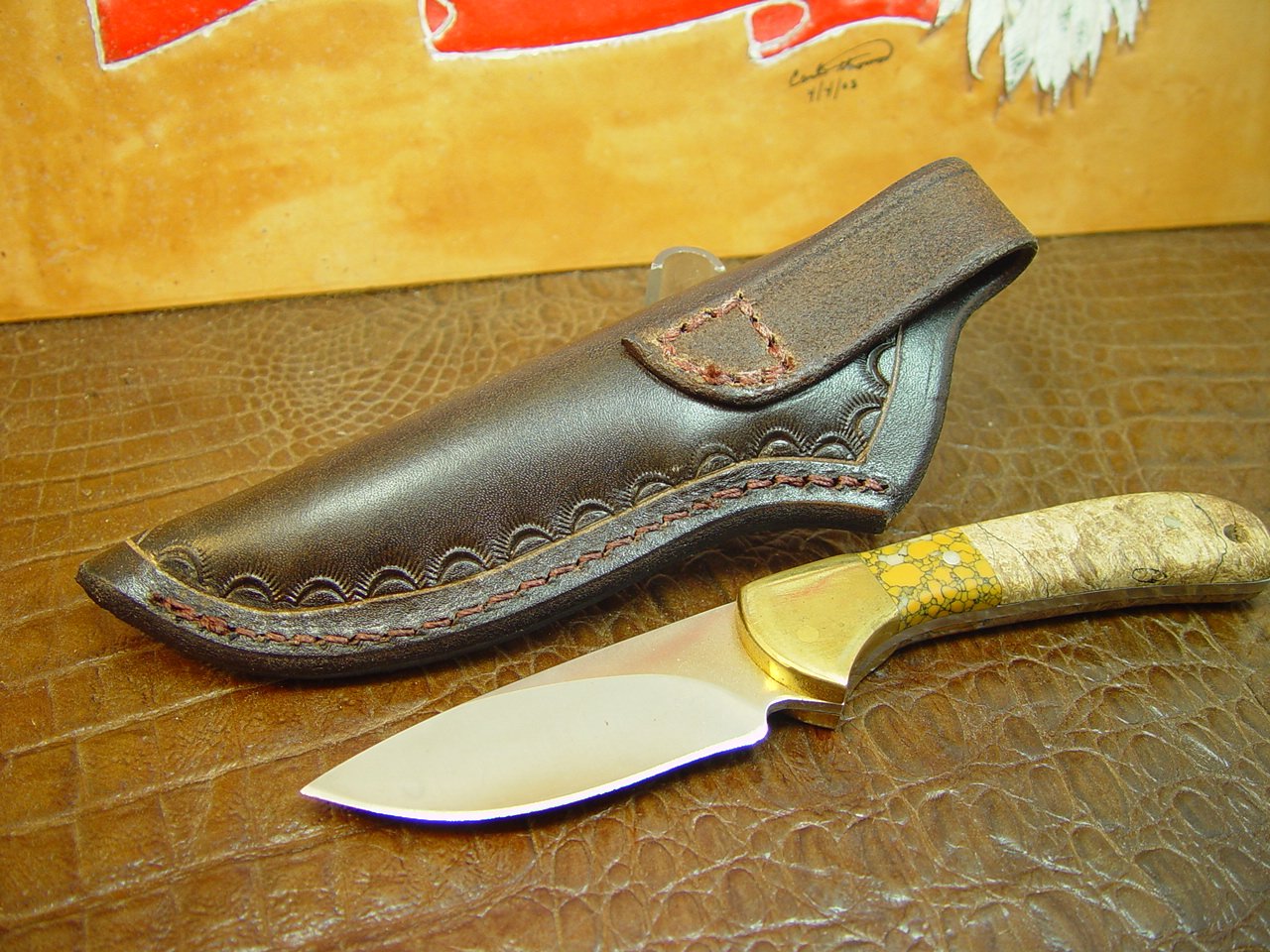 Custom Leather Vertical Knife Sheath. The Sheath Is Made Out of 10 Ounce Water Buffalo Hide Leather with a Border Tooling Dyed Dark Brown. The Sheath Is Made Out of Water Buffalo Leather the Water Buffalo Leather Is Very Soft Pliable and Durable. The Shea