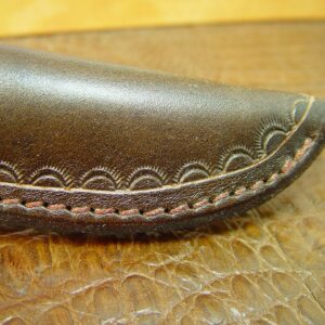 Custom Leather Vertical Knife Sheath. The Sheath Is Made Out of 10 Ounce Water Buffalo Hide Leather with a Border Tooling Dyed Dark Brown. The Sheath Is Made Out of Water Buffalo Leather the Water Buffalo Leather Is Very Soft Pliable and Durable. The Shea