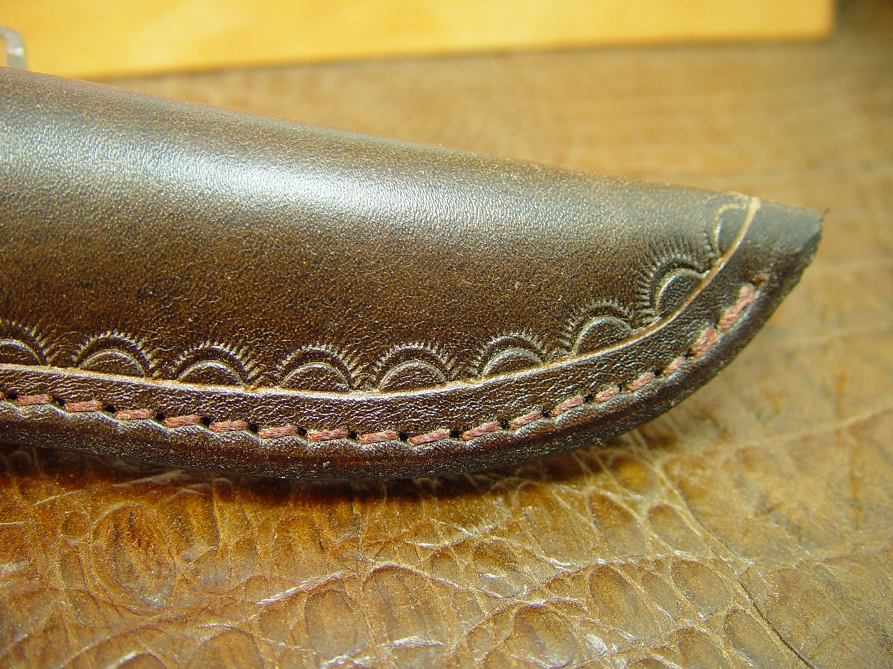 Custom Leather Vertical Knife Sheath. The Sheath Is Made Out of 10 Ounce Water Buffalo Hide Leather with a Border Tooling Dyed Dark Brown. The Sheath Is Made Out of Water Buffalo Leather the Water Buffalo Leather Is Very Soft Pliable and Durable. The Shea