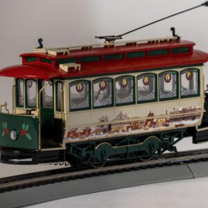 Bachmann Trains - Norman Rockwell's Main Street Christmas Battery Operated Auto Reversing Village Streetcar Set - On30 Scale - Runs on HO Track