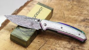 buckshot knives thumb open spring assisted stainless steel titanium handle with 3d etched inlay, etched damascus wave blade pocket knife (pbk215rw)