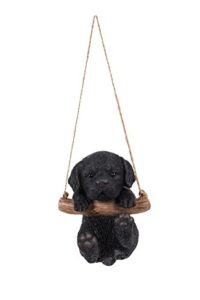 hanging black lab puppy