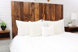 barn walls solid wood king size headboard, foxy brown stain with smooth natural wood grain variation, handcrafted head board wall-mounted panels, rustic modern bedroom, built to last