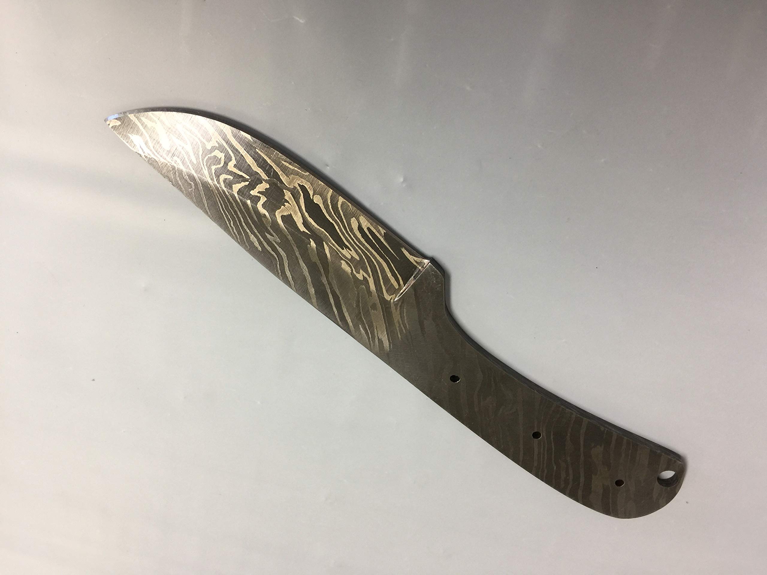 8.5 inches long hand forged Twist pattern Damascus steel trailing point blank blade skinning knife with 3 Pin hole & an inserting hole space 4 inches cutting edge