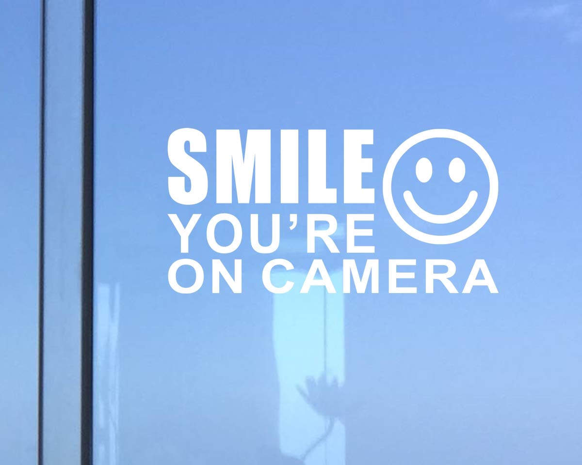 (2 Pack) 7"x3.5" White - Smile You're On Camera - UV Resistant, Waterproof, Peel & Stick Decor Decal Sticker Quote Adhesive Vinyl Mural Art Script Lettering - For storefronts, cars, trucks, boats, etc