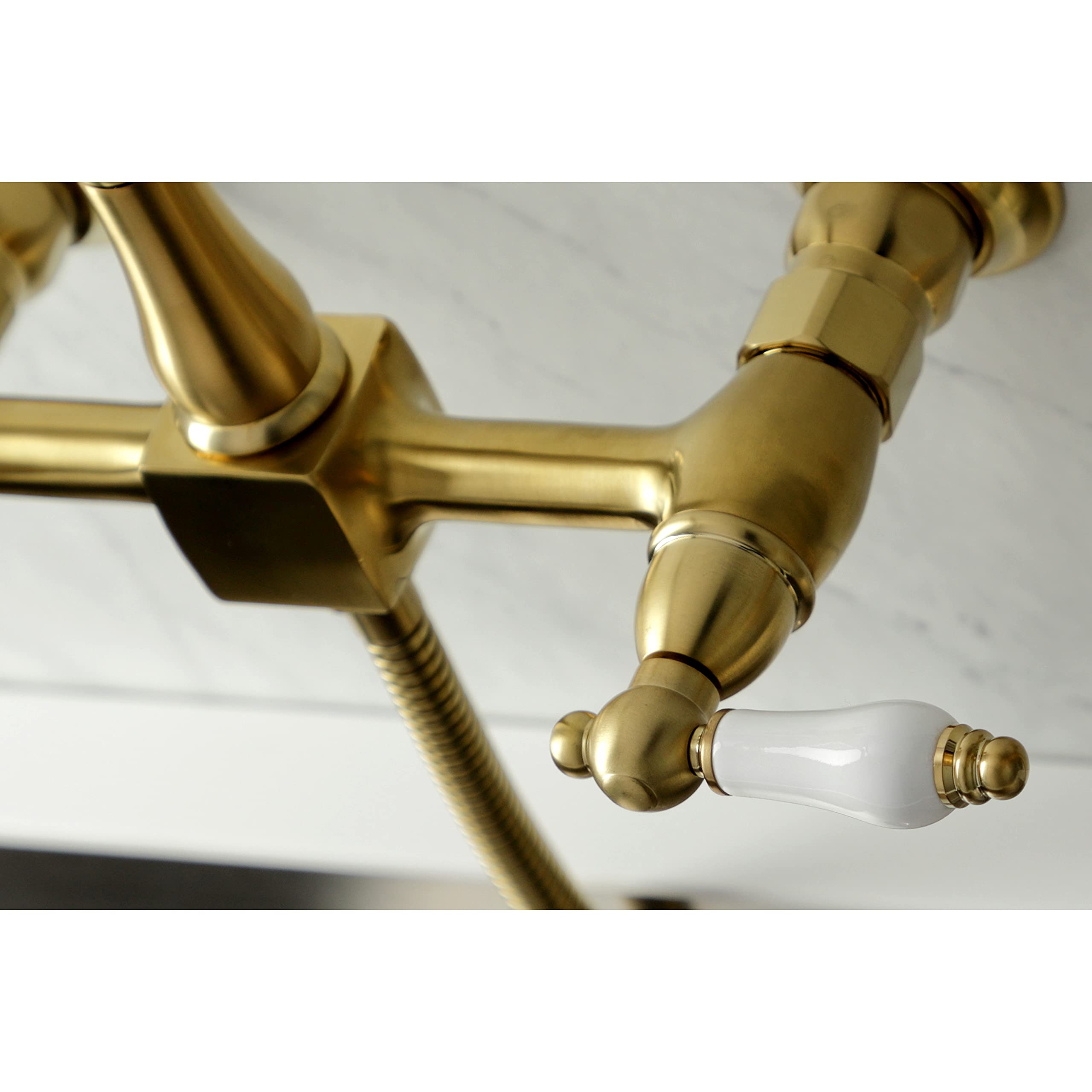 Kingston Brass KS1267PLBS Heritage 8-Inch Centerset Wall Mount Kitchen Faucet with Brass Sprayer, Brushed Brass