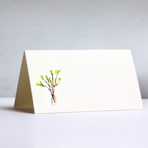 nancy nikko place cards with twigs with green leaves in clear vase for weddings, showers, and dinner parties. table tent style, scored for easy folding. available in pkgs of 50