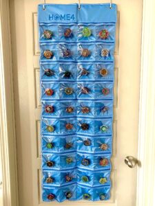 home4 toy hanging over the door storage bag - 40 clear view pockets - roll up for easy organizer - save space more than case box - compatible with beyblade hot wheels and more toys not included (blue)