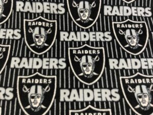 60" fleece 100% polyester raiders allover black, grey, and white