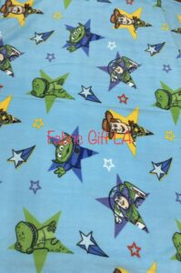 disney toy story 4 character stars on sky blue fleece from springs creative buzz light year and woody fabric by the yard