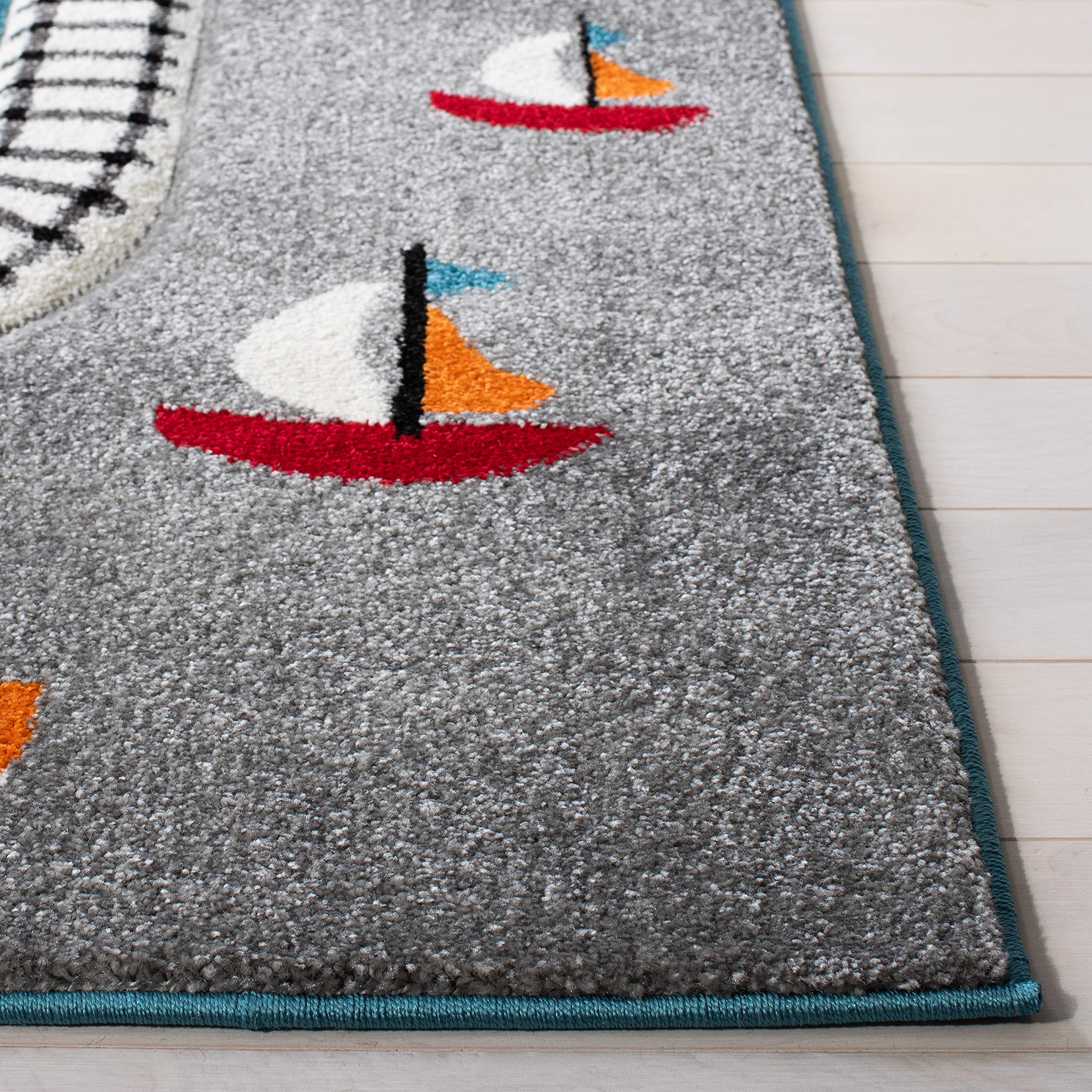 SAFAVIEH Carousel Kids Collection Area Rug - 6'7" x 9', Turquoise & Ivory, Non-Shedding & Easy Care, Ideal for High Traffic Areas for Boys & Girls in Playroom, Nursery, Bedroom (CRK192K)