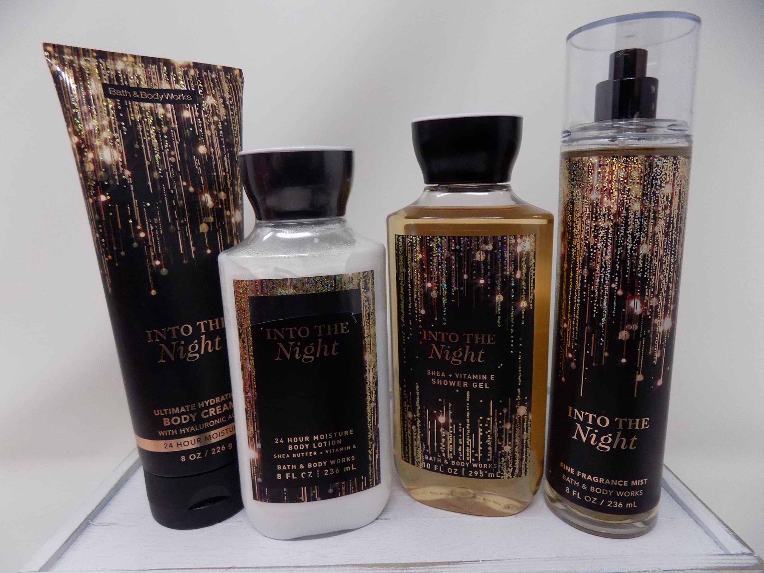 Into The Night 4 Piece Gift Set 1-10 Oz Shower Gel, 1-8 Oz Body Cream, 1-8 Oz Fine Fragrance Mist, 1-8 Oz Body Lotion