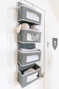 cradle essentials over door hanging organizer | storage caddy for newborn and baby items, stuffed animals | large pockets with clear windows for nursery, mudroom, bathroom, laundry, pantry, closet