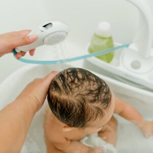 The First Years Rain Shower Baby Shower Head - Soothing Attachable Baby Spa Sprayer - Baby Bathtub Shower Head with Rotating Arm