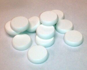 white wooden crokinole discs - set of 14