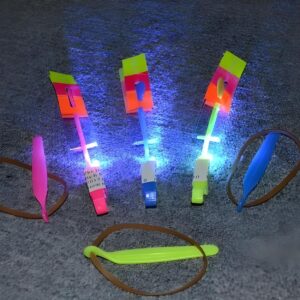 Dozen Light Up LED Slingshot Style Flying Helicopter Toy