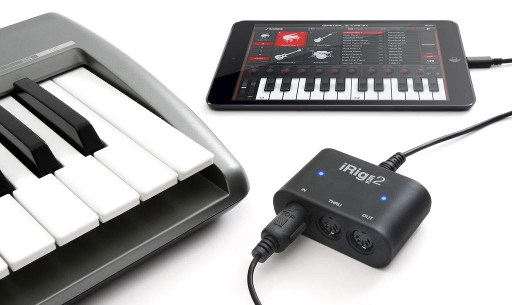 IK Multimedia iRig MIDI 2 universal MIDI interface with In, Out, and THRU ports, activity indicators for iPhone, iPad, Android, Mac, PC